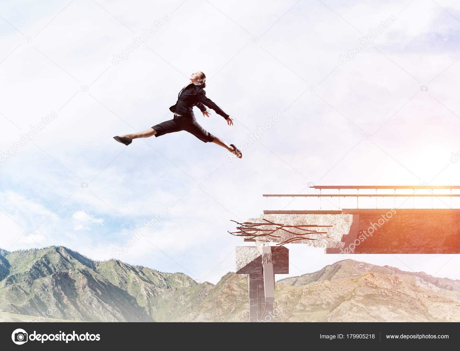 Woman jumping over huge gap — Stock Photo © Khakimullin #179905218