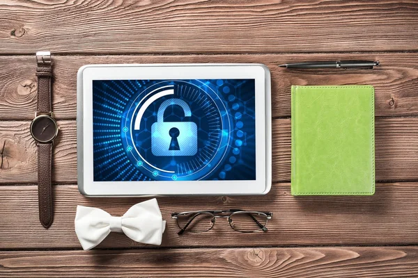 male accessories and tablet pc with security concept on screen - Stock ...
