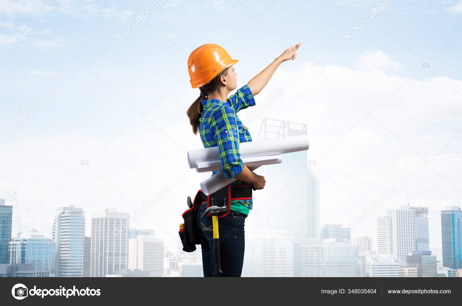 Female Engineer Hardhat Standing Technical Blueprints Pointing Upwards ...