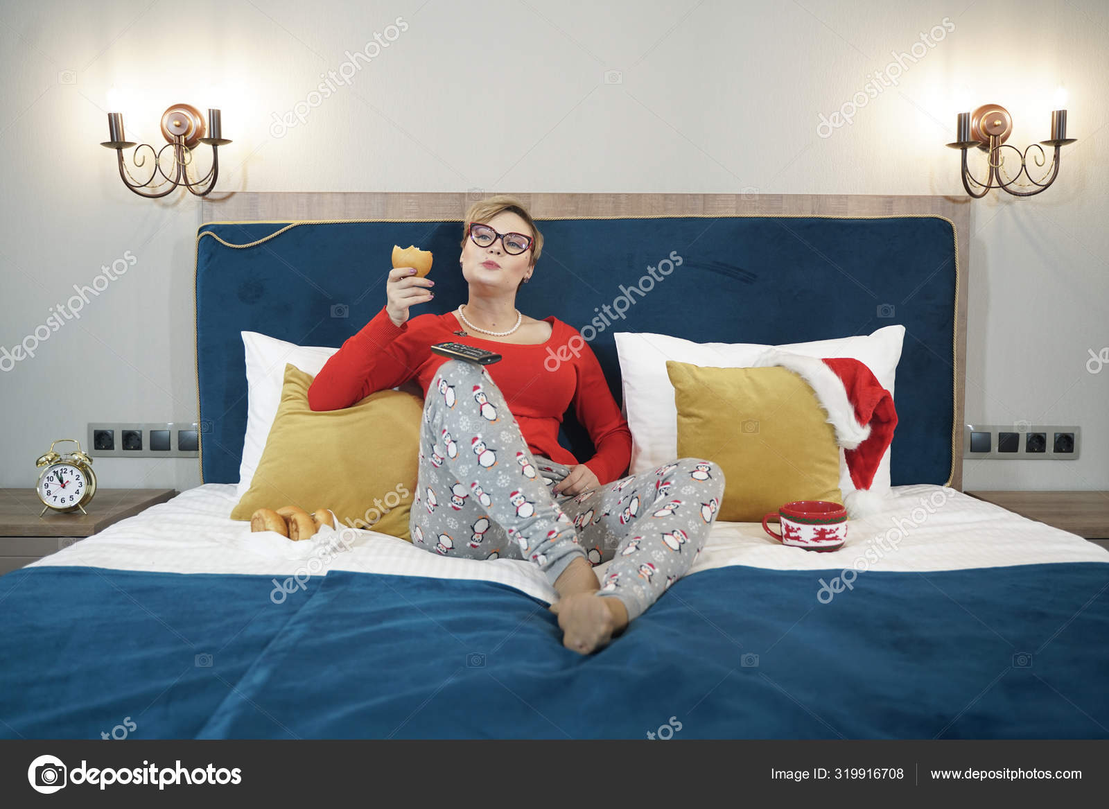 Woman watching television while dining with a bun — Stock Photo © agnadevi #319916708