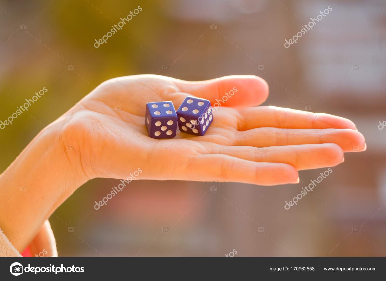 Woman Hand Rolling Dice