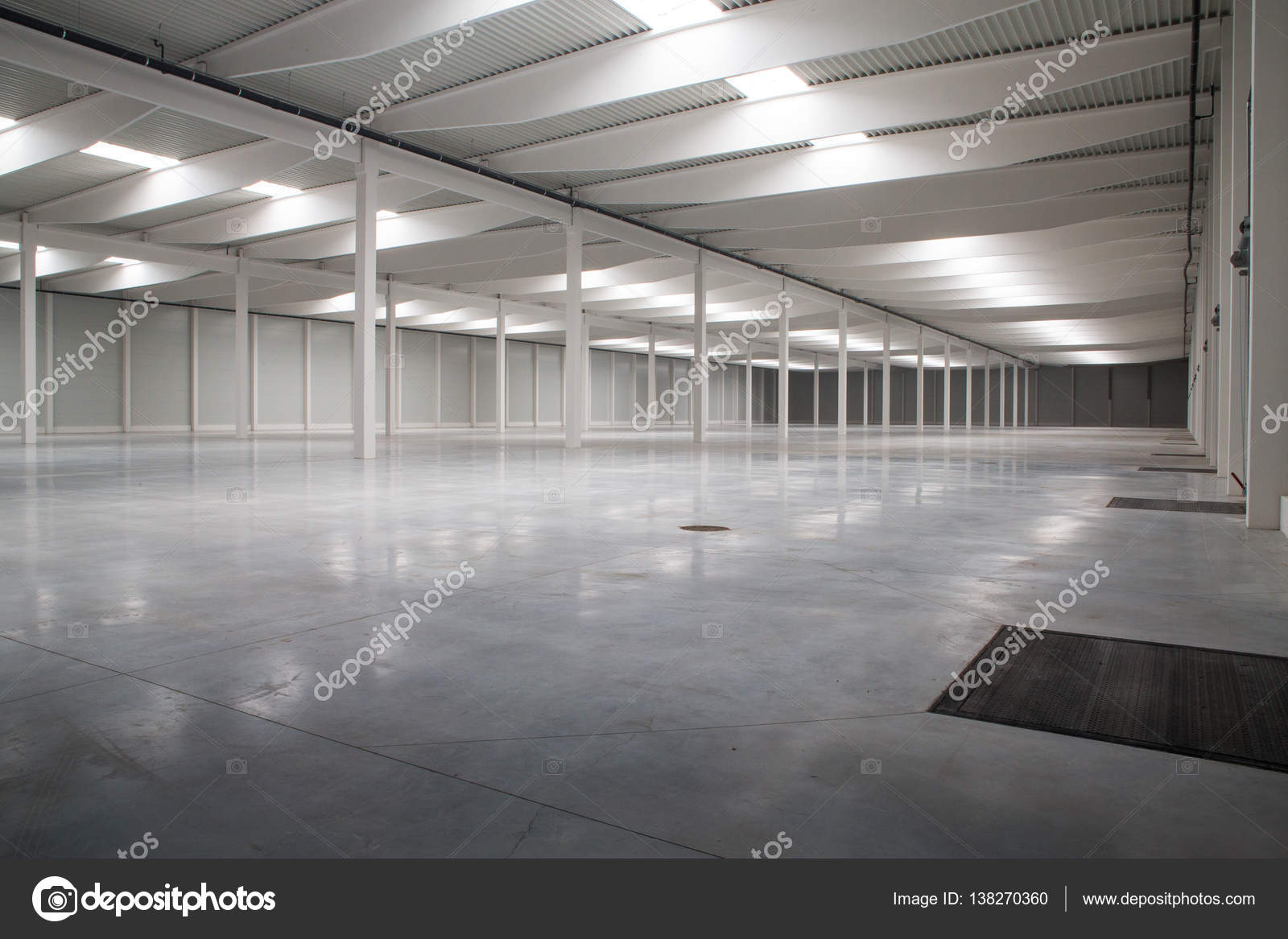 Huge white new warehouse Stock Photo by ©isvadby@gmail.com 138270360