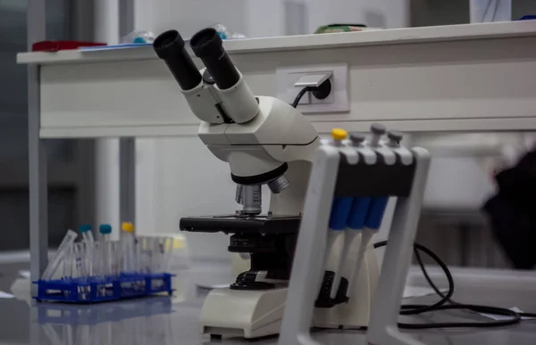Microscope and test tubes in laboratory Stock Photo by ©AndreyBezuglov ...