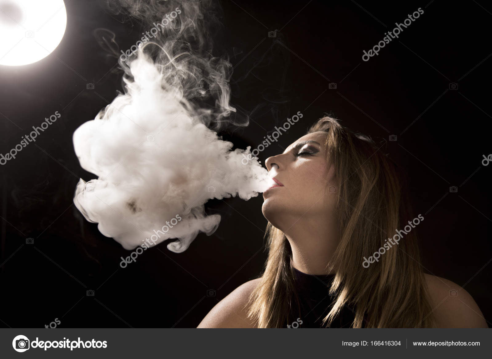 Young woman vaping — Stock Photo © erllre #166416304