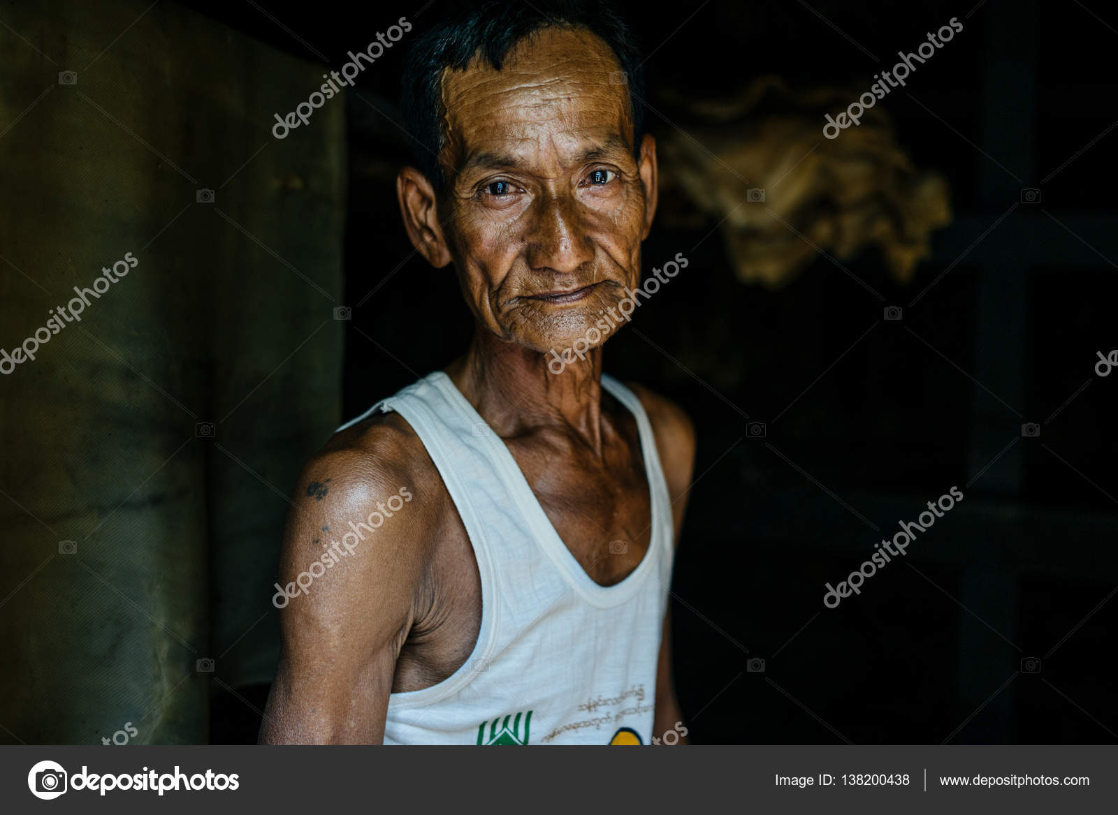Man in white tank looking at camera — Stock Editorial Photo © costasd68 ...