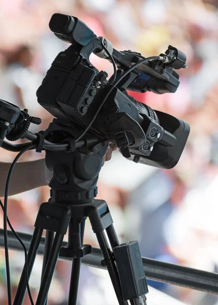 Professional TV camera making a movie of event. - Stock Image - Everypixel