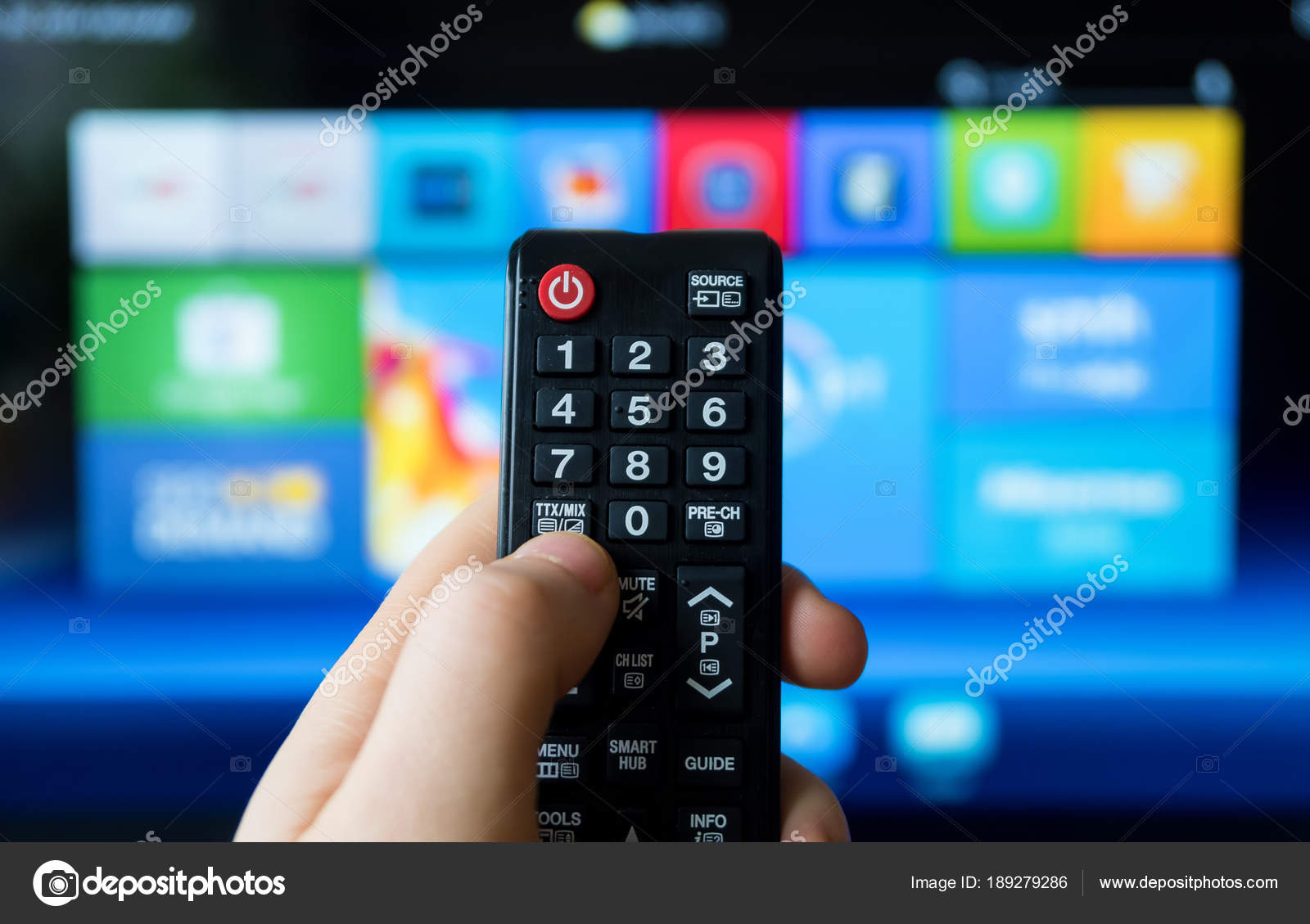 Male hand holding TV remote control. Smart TV. — Stock Photo ... Male hand holding TV remote control. Smart TV. — Stock Photo ...