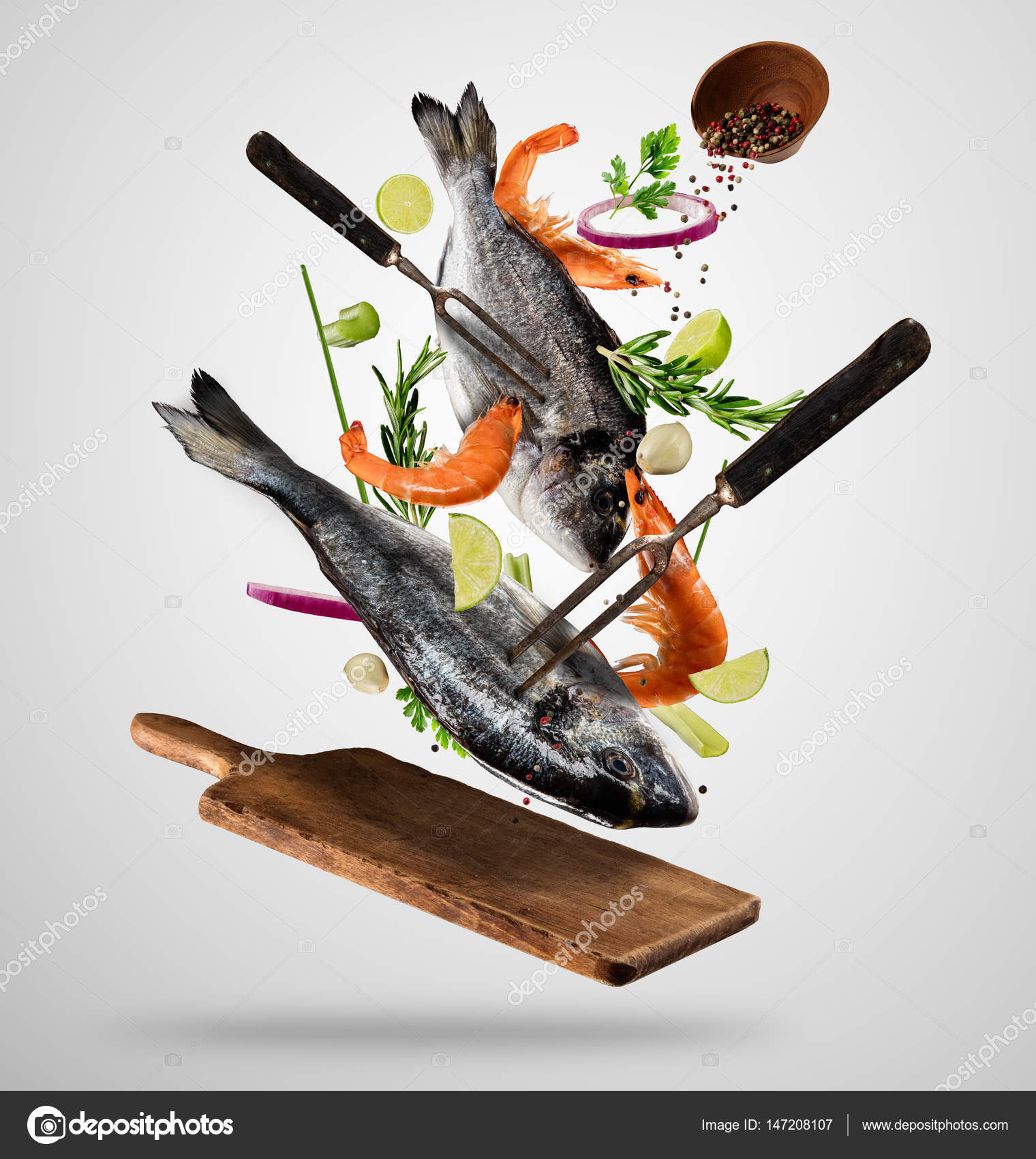 Flying raw whole bream fish and prawns with ingredients ⬇ Stock Photo ...