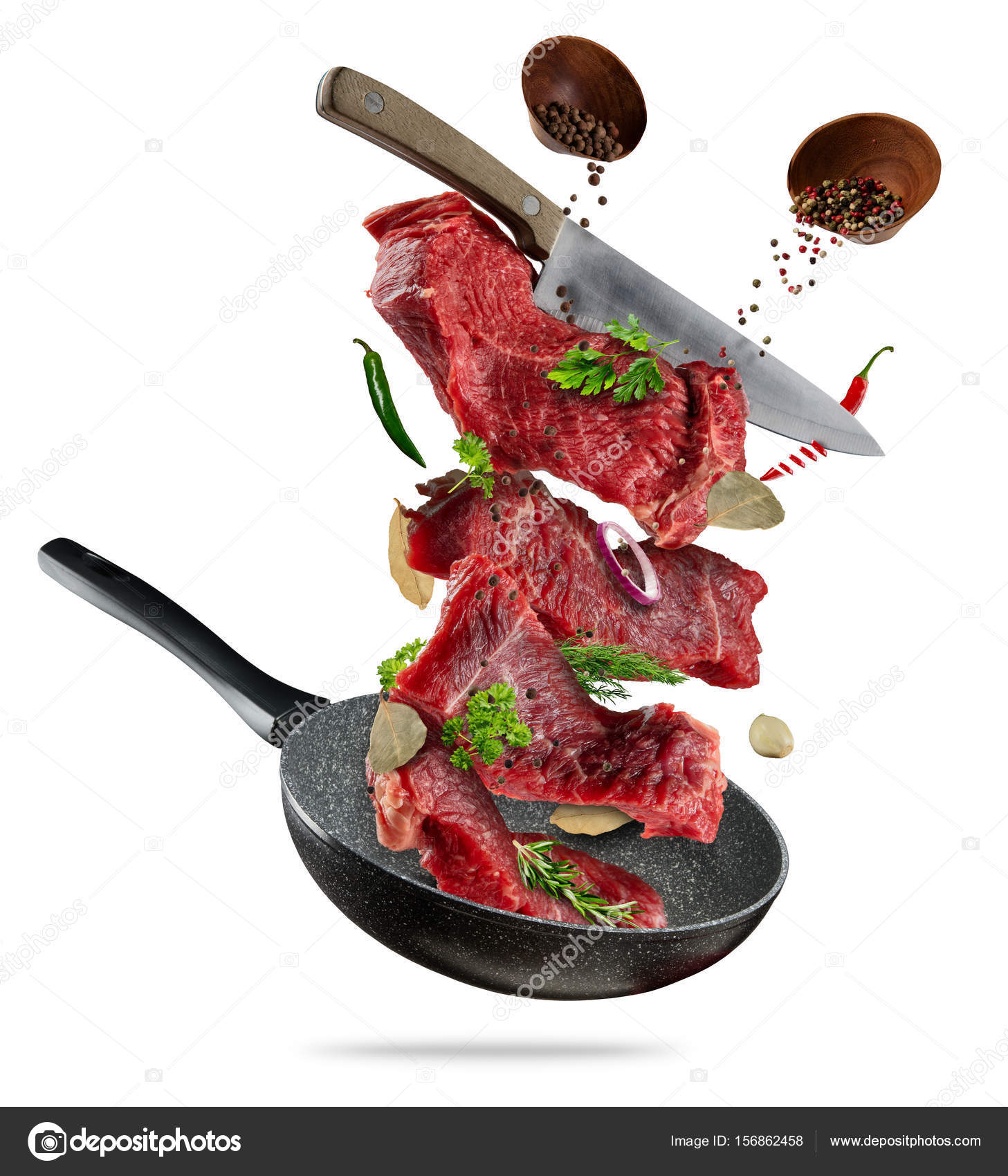 Flying raw steaks with cooking ingredients from pan Stock Photo by ©jag ...