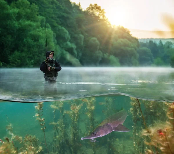 Fisherman trying to catch predator fish, half to half image mant ...