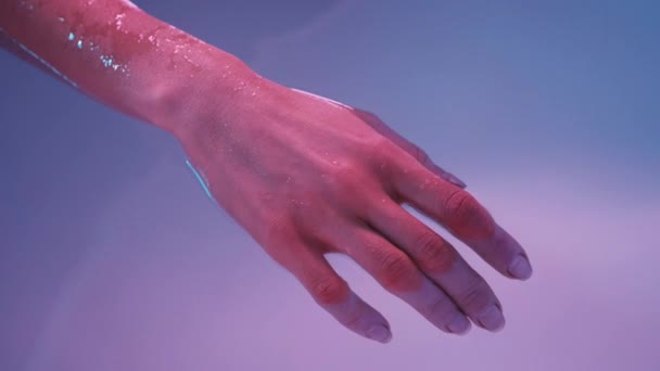 Young womans hand floating in Spa bath or swimming pool, she is very ...