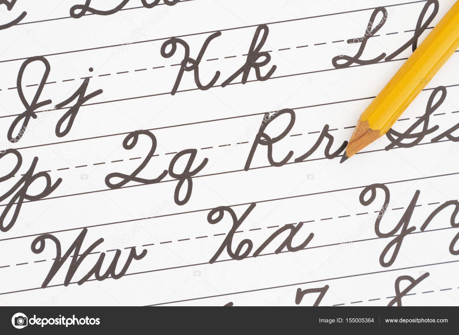 Learning to write cursive lettering Stock Photo by ©karenr 155005364