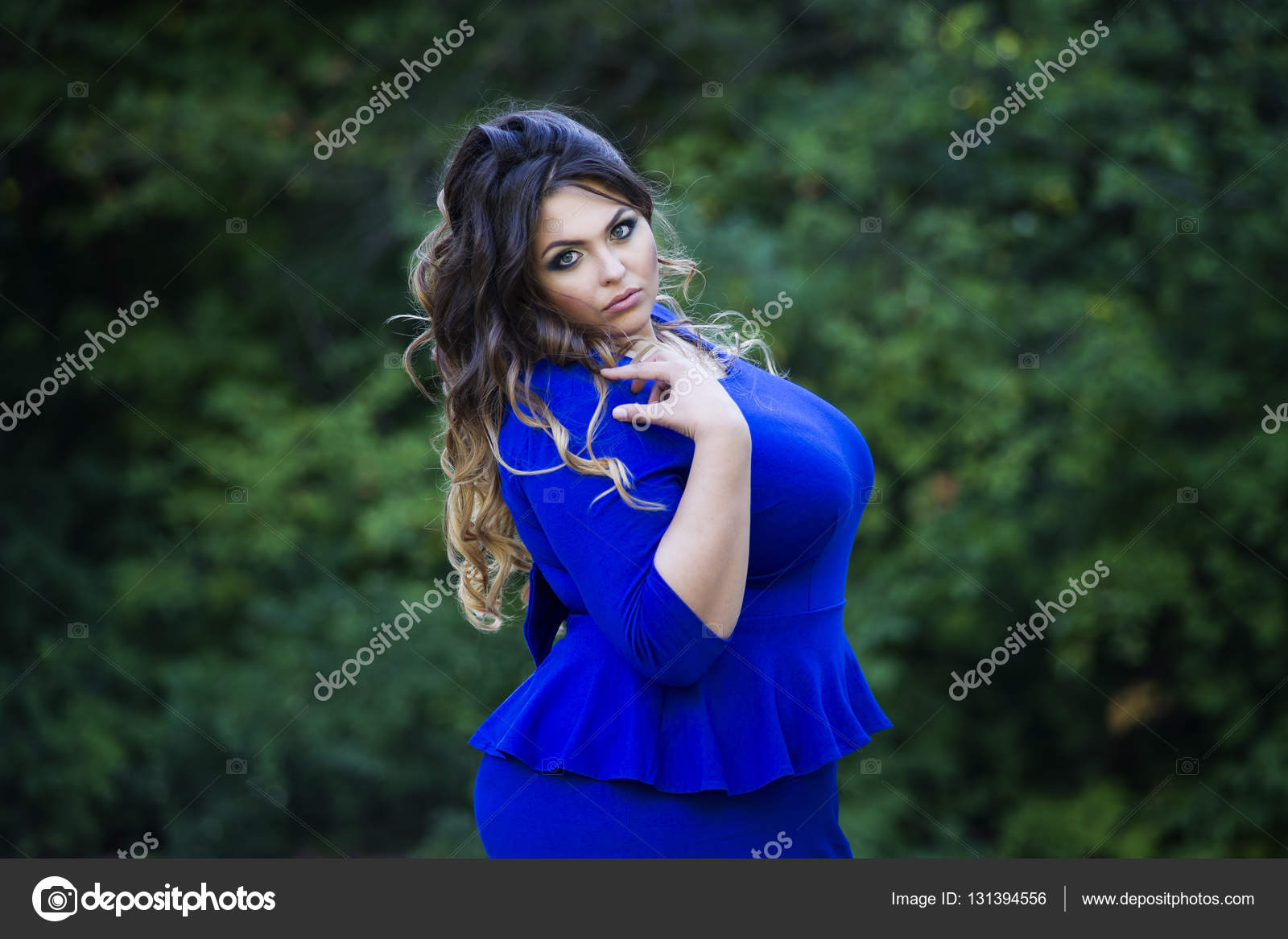 Young beautiful plus size model in blue dress outdoors, xxl woman on ...