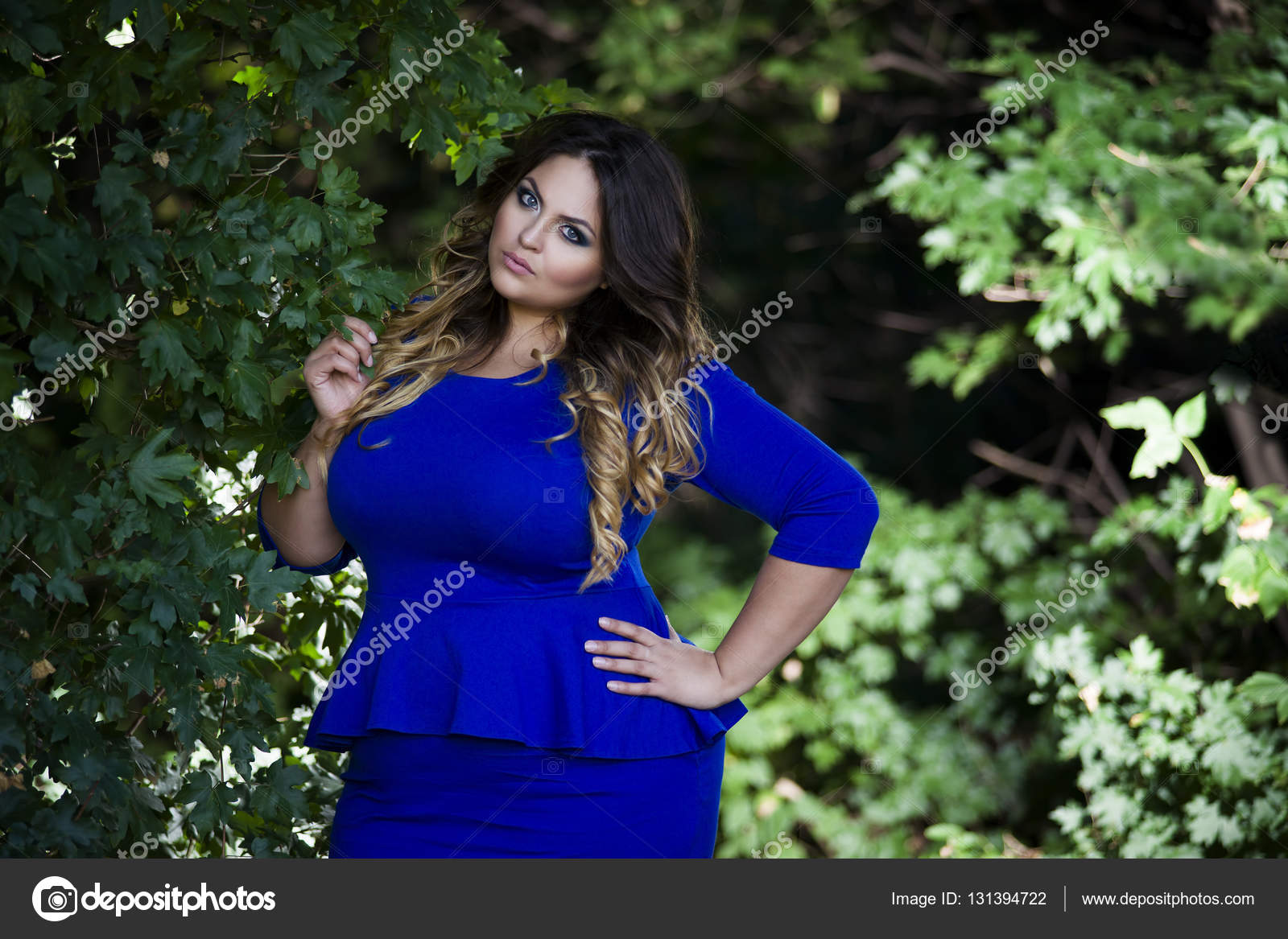 Young beautiful plus size model in blue dress outdoors, xxl woman on ...