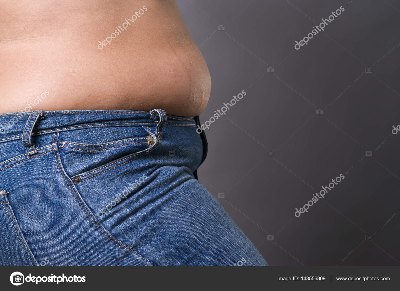 Woman With Fat Abdomen In Blue Jeans Overweight Female Stomach