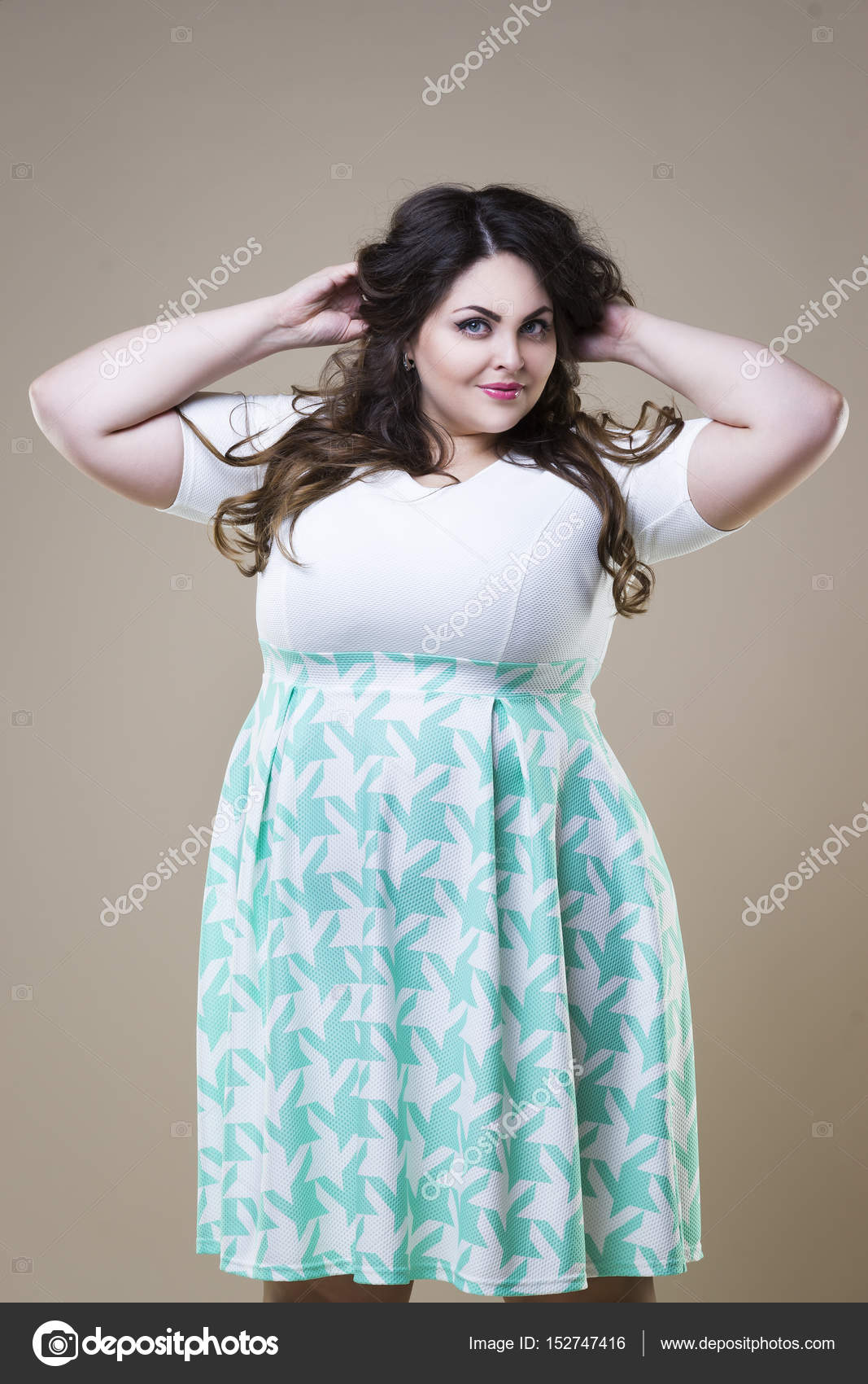 Plus size fashion model in casual clothes, fat woman on studio ...