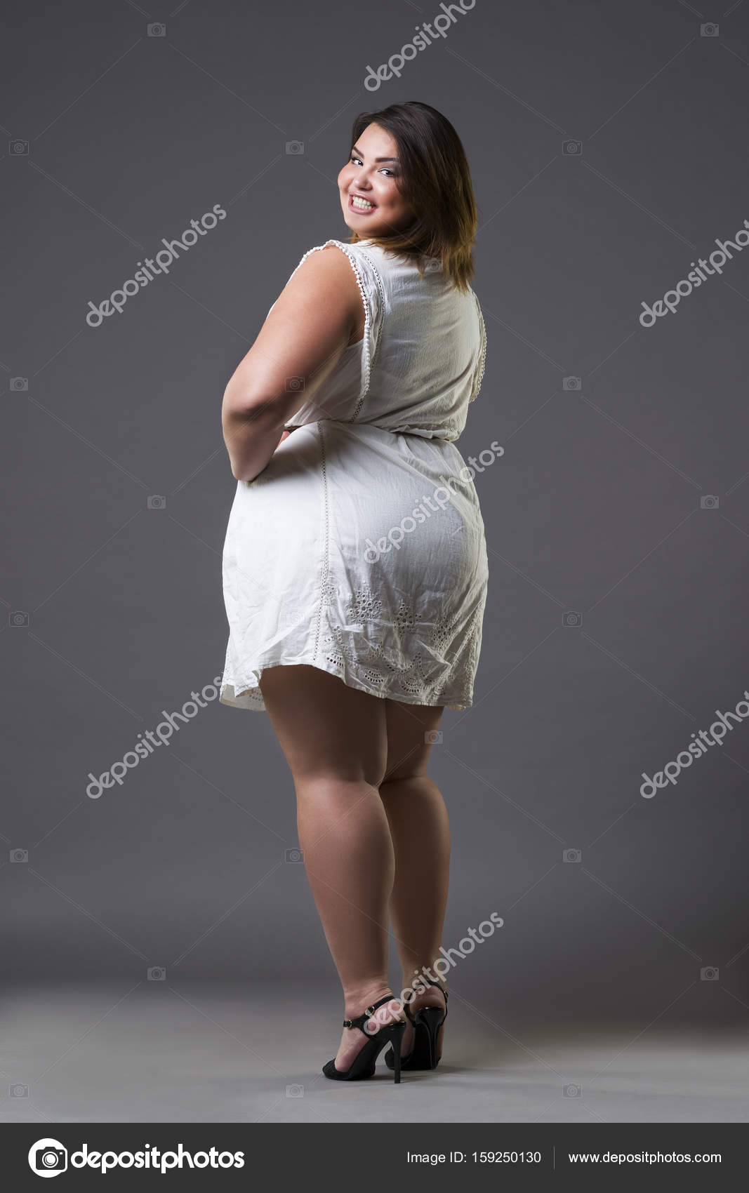 Happy Plus Size Fashion Model In Casual Clothes Fat Woman On Gray