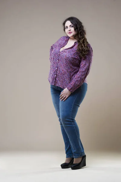 Plus size fashion model in casual clothes, fat woman on studio ...