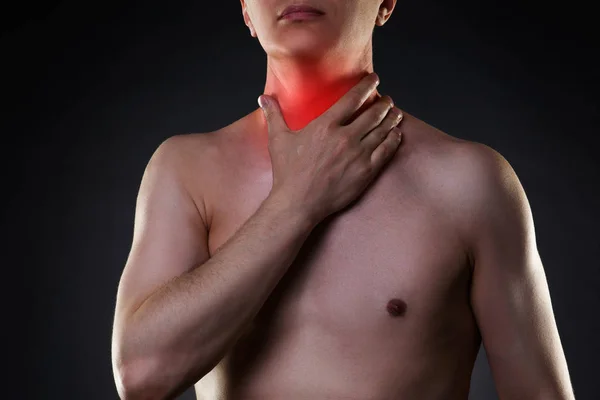 Sore throat, men with neck pain Stock Photo by ©starast 297569476