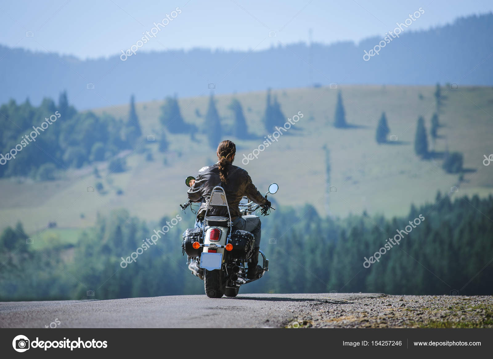 Biker driving his cruiser motorcycle on road Stock Photo by ©anatoliy ...