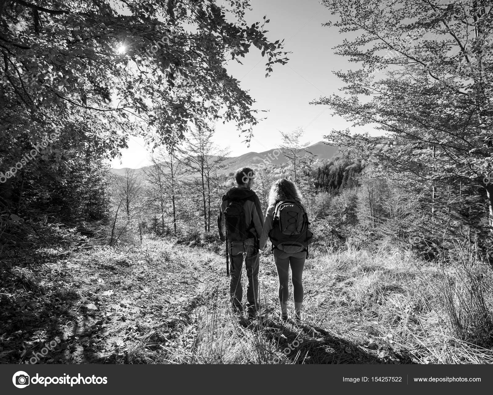 Couple hikers enjoying beautiful scenery on valley — Stock Photo ...