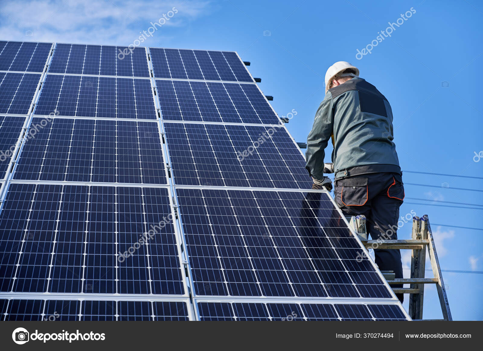 Back View Man Technician Standing Ladder Installing Photovoltaic Solar ...