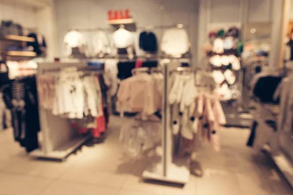 Clothes in store. Shopping clothes store blurred background - Stock ...