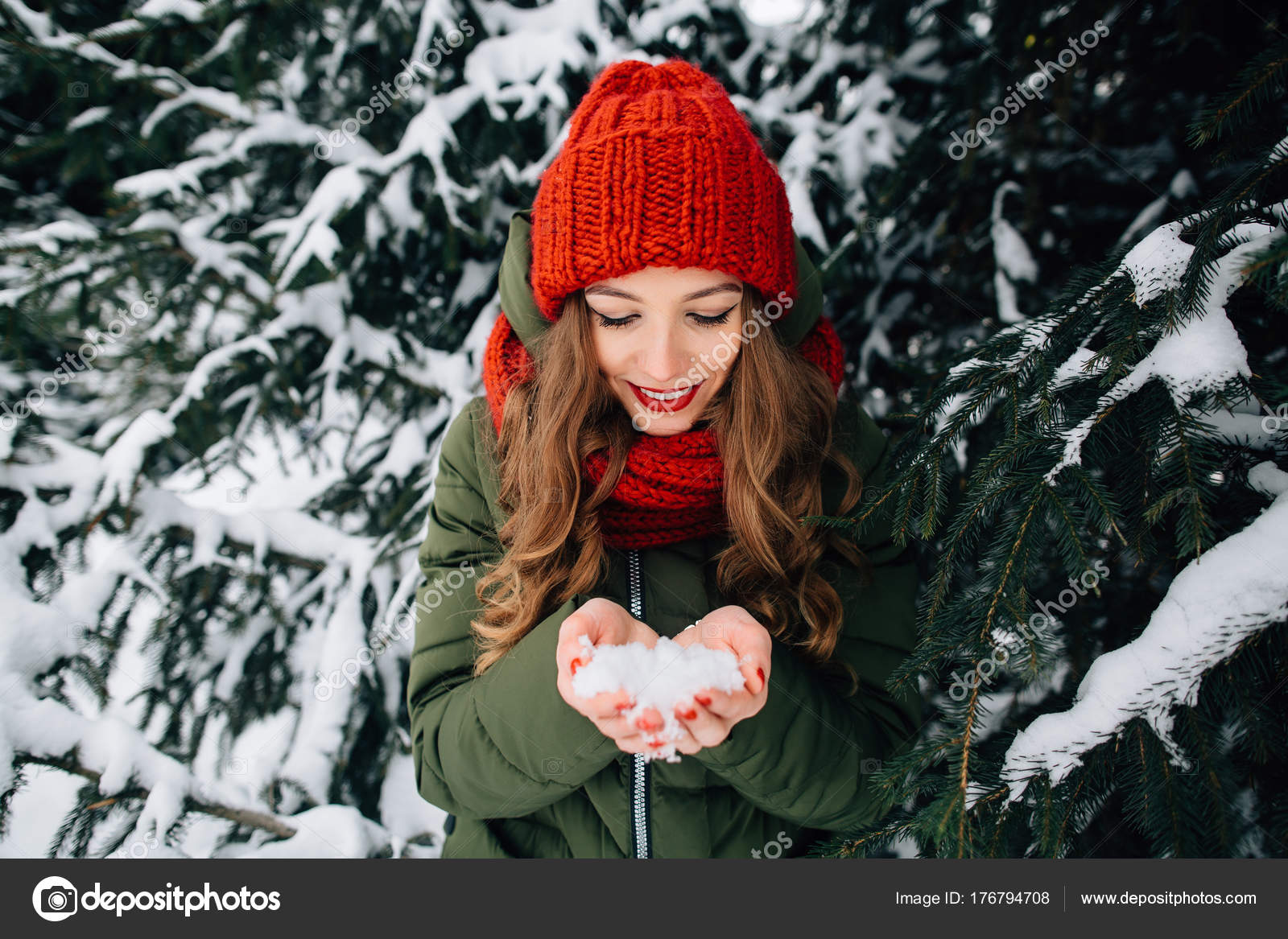 Girl holds snow in hands in winter snowy forest — Stock Photo ...