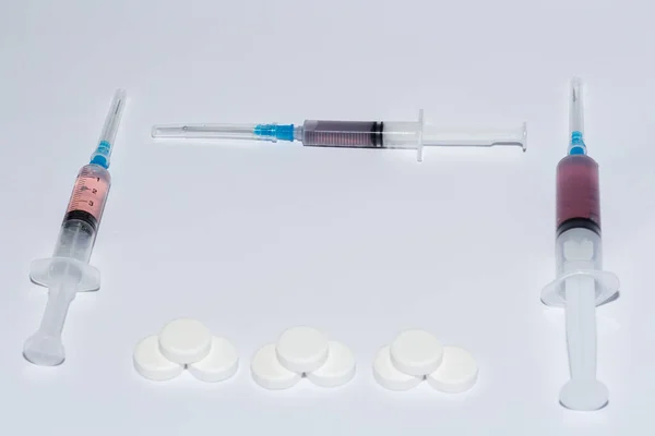 Syringe and tablets Stock Photos, Royalty Free Syringe and tablets ...