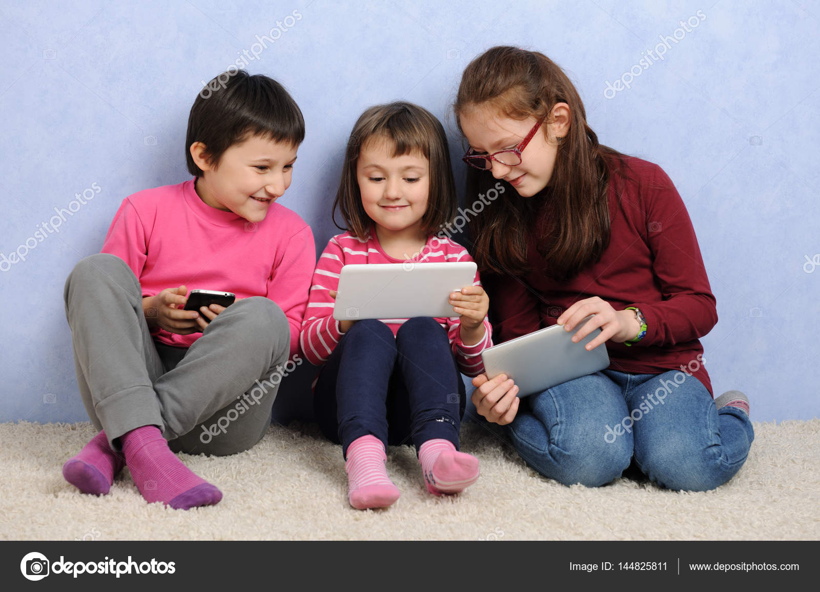 Children with tablet Stock Photo by ©annakhomulo 144825811