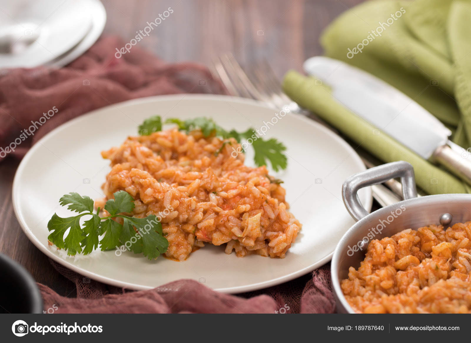 Rice with fish and seafood on plate Stock Photo by ©nataliamylova 189787640
