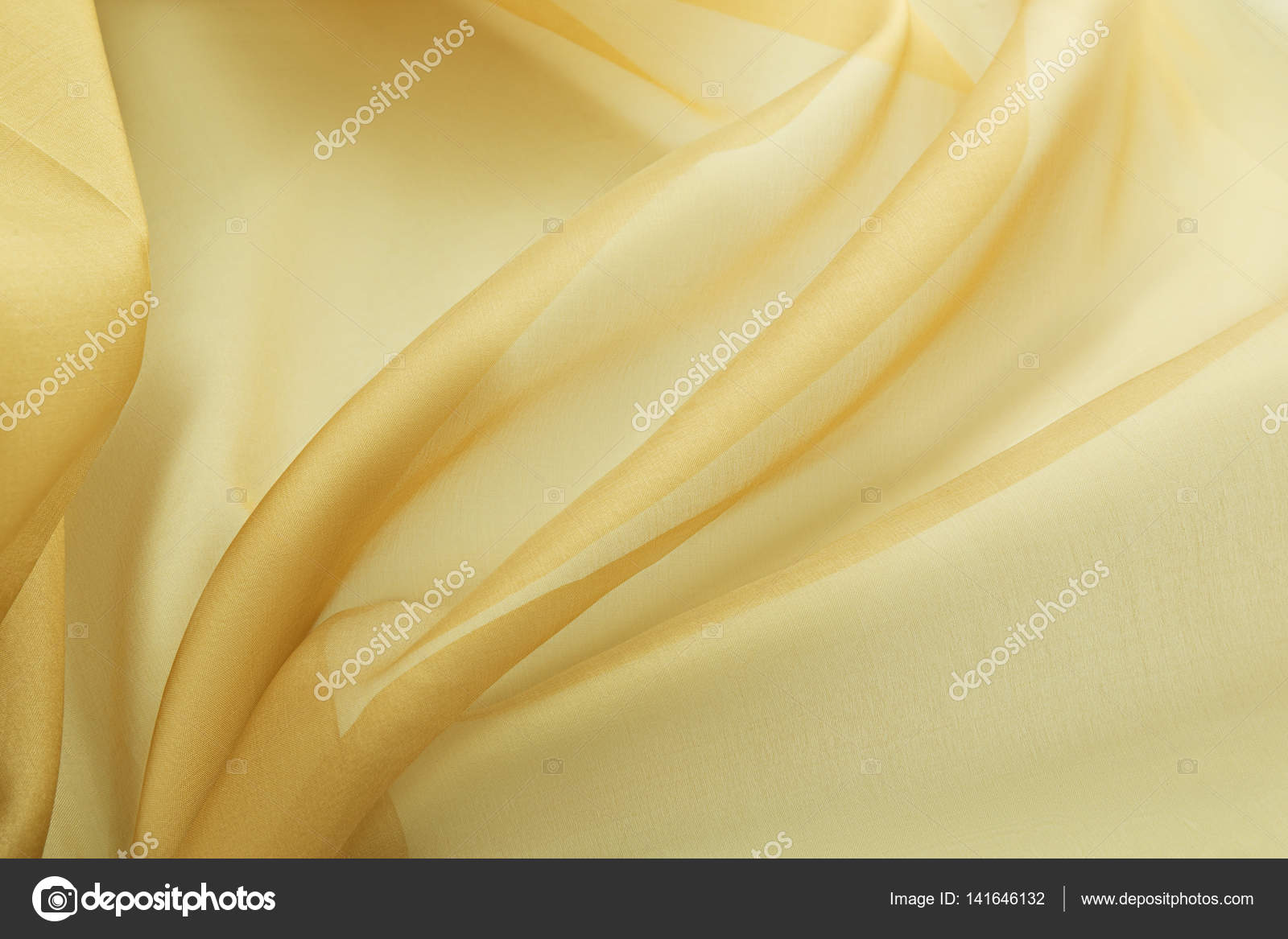 Yellow background luxury cloth or wavy folds of grunge silk texture ...