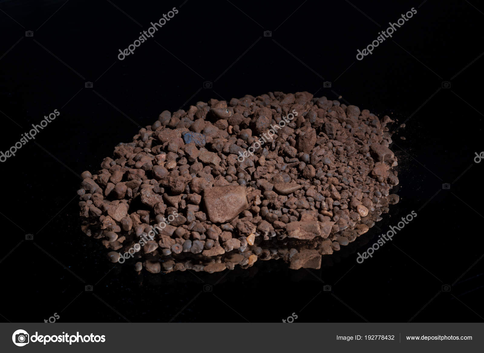 Ore from a diamond mine. isolated on black background with reflexion ...
