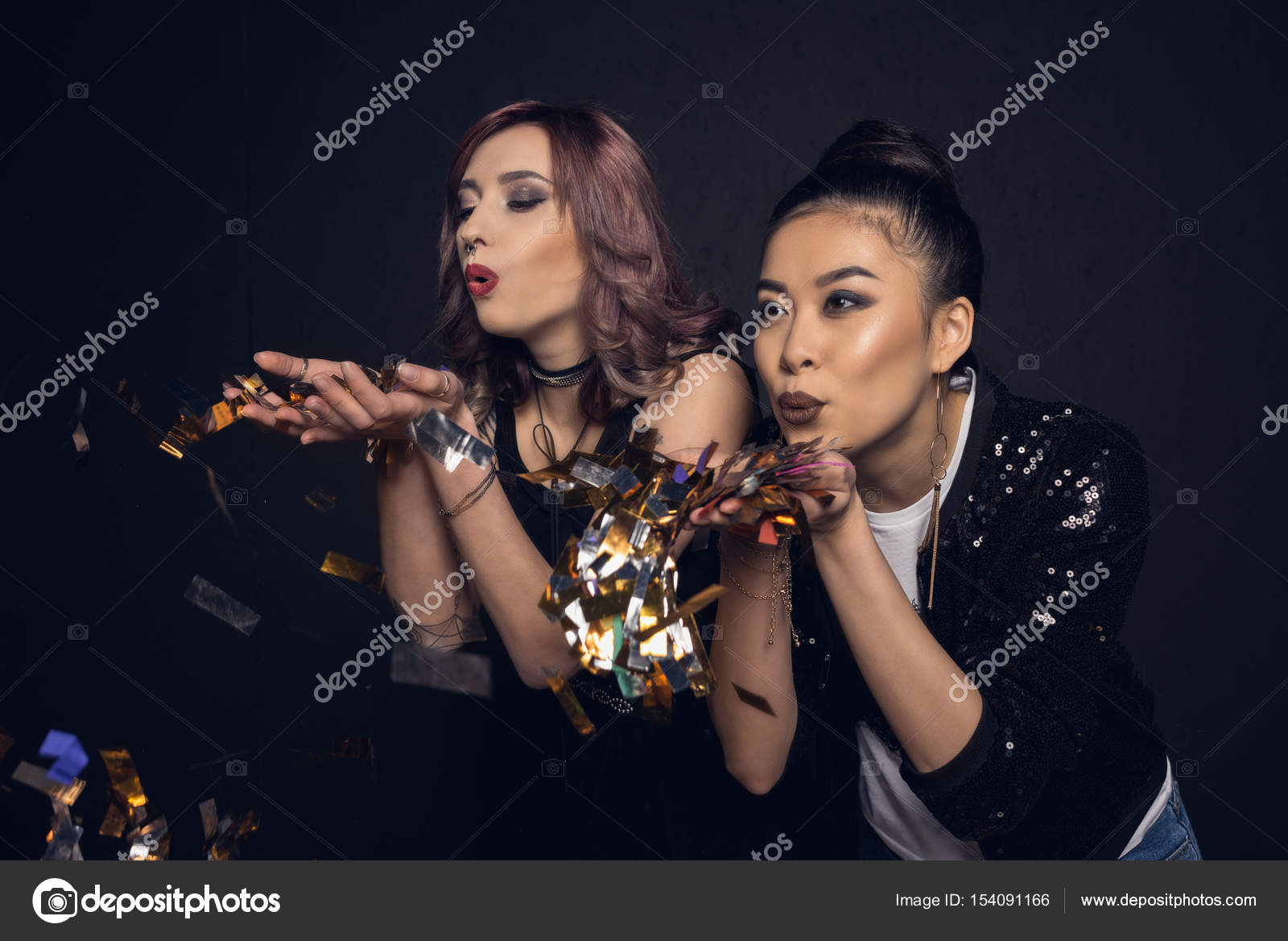 Young women with confetti — Stock Photo © NatashaFedorova #154091166