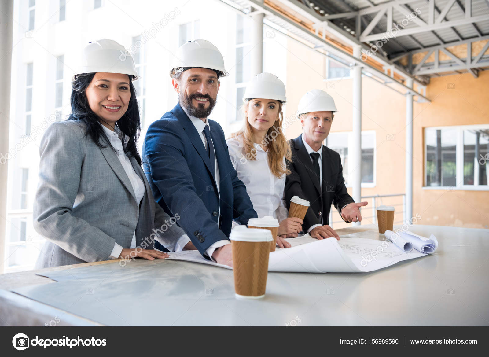 Group of multiethnic architects in suits Stock Photo by ...