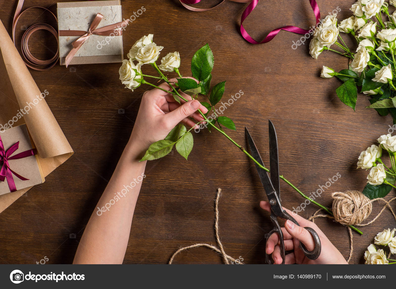 Hands cutting roses — Stock Photo © AndrewBedrov #140989170