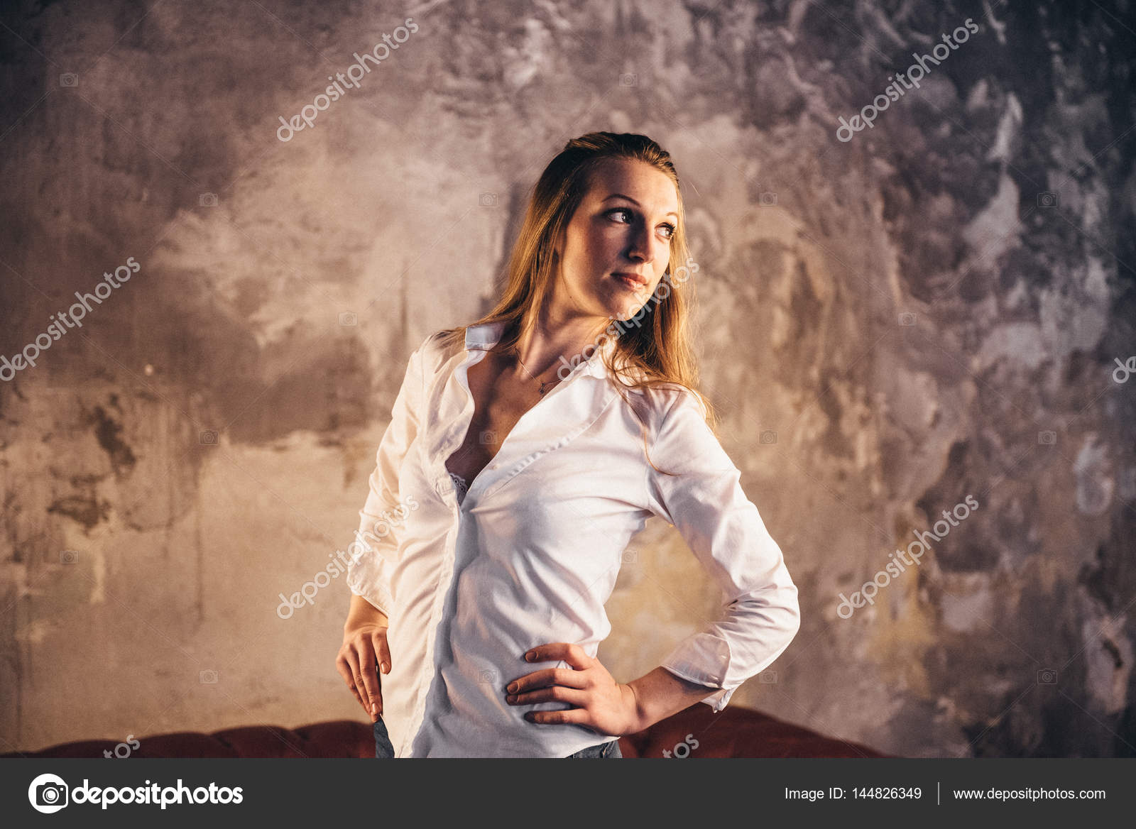 Girl actress on the couch in the light of soffits — Stock Photo ...