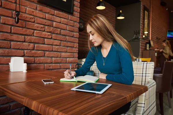 Female using toch pad Stock Photo by ©AlissaStock 138881852