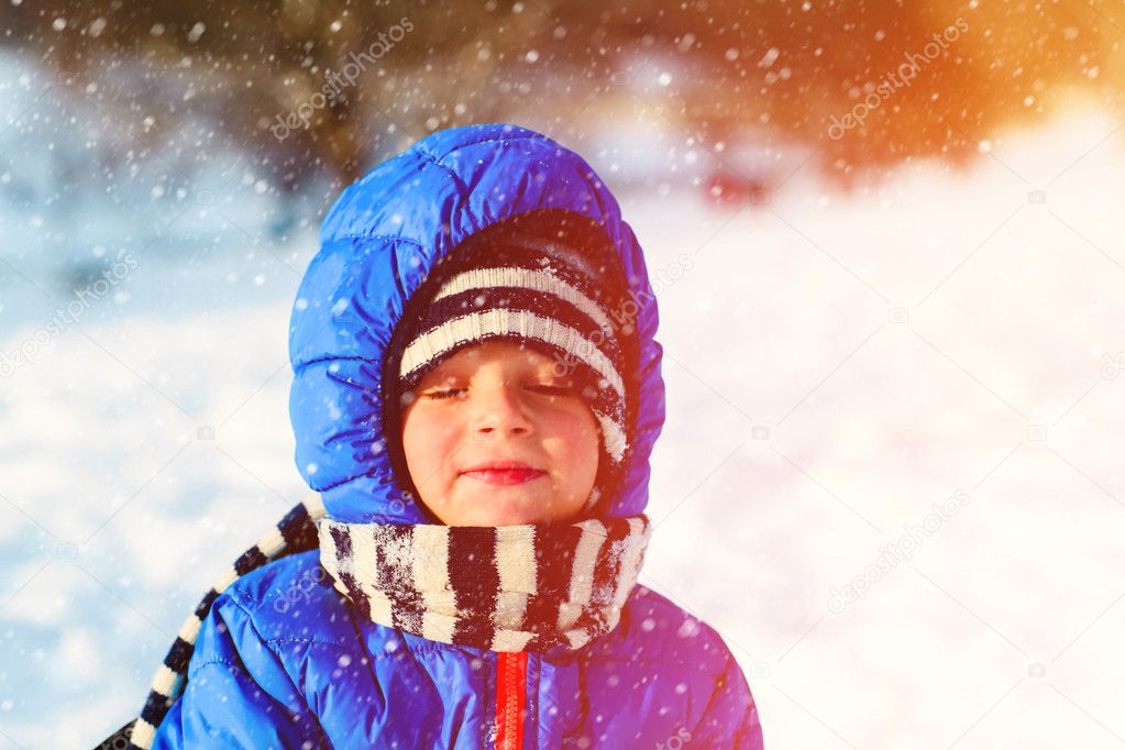 Little boy enjoy snow in nature Stock Photo by ©Nadezhda1906 127626414
