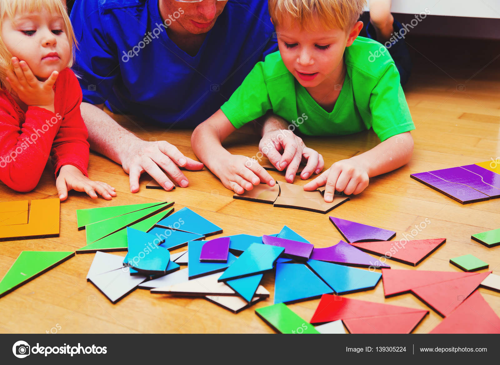Teacher and kids playing with geometric shapes — Stock Photo ...
