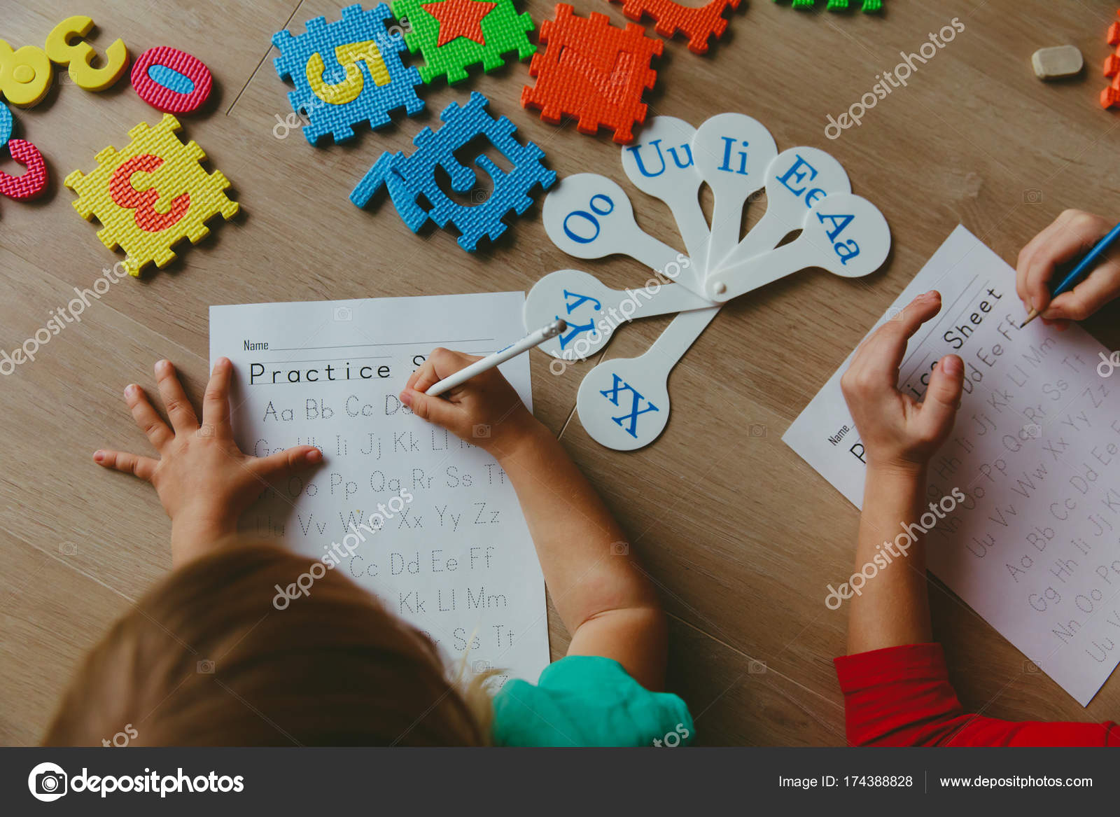 Kids learning to write letters doing homework Stock Photo by ...