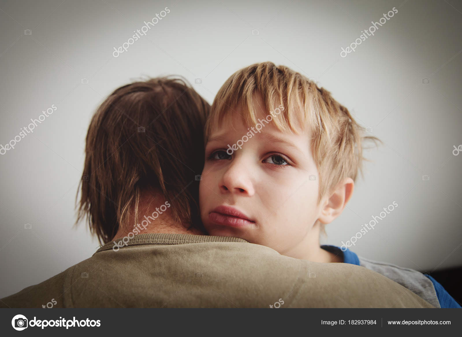 Father comforting stressed sad son Stock Photo by ©Nadezhda1906 182937984