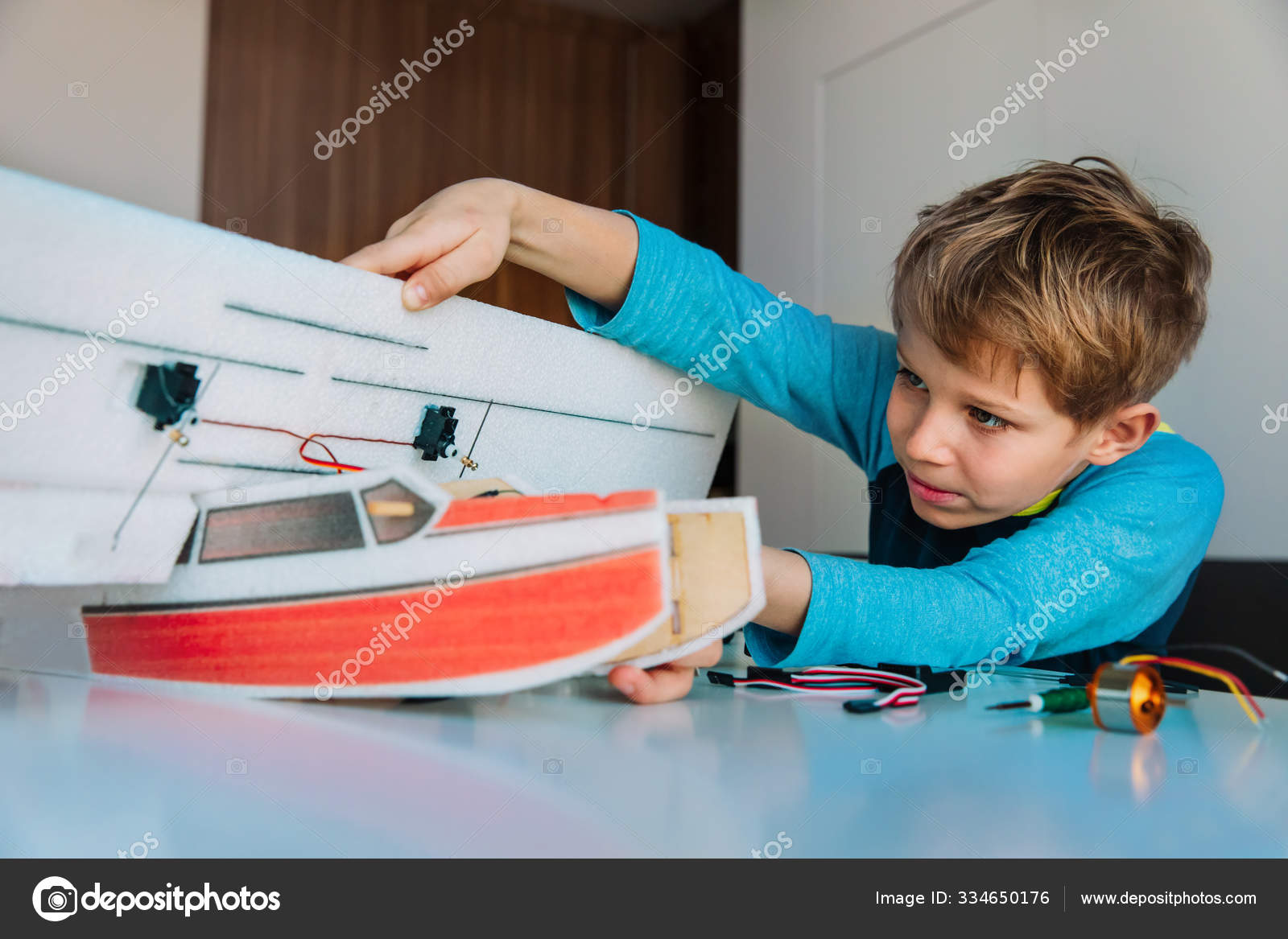 Boy making model of plane, kids engineering Stock Photo by ...