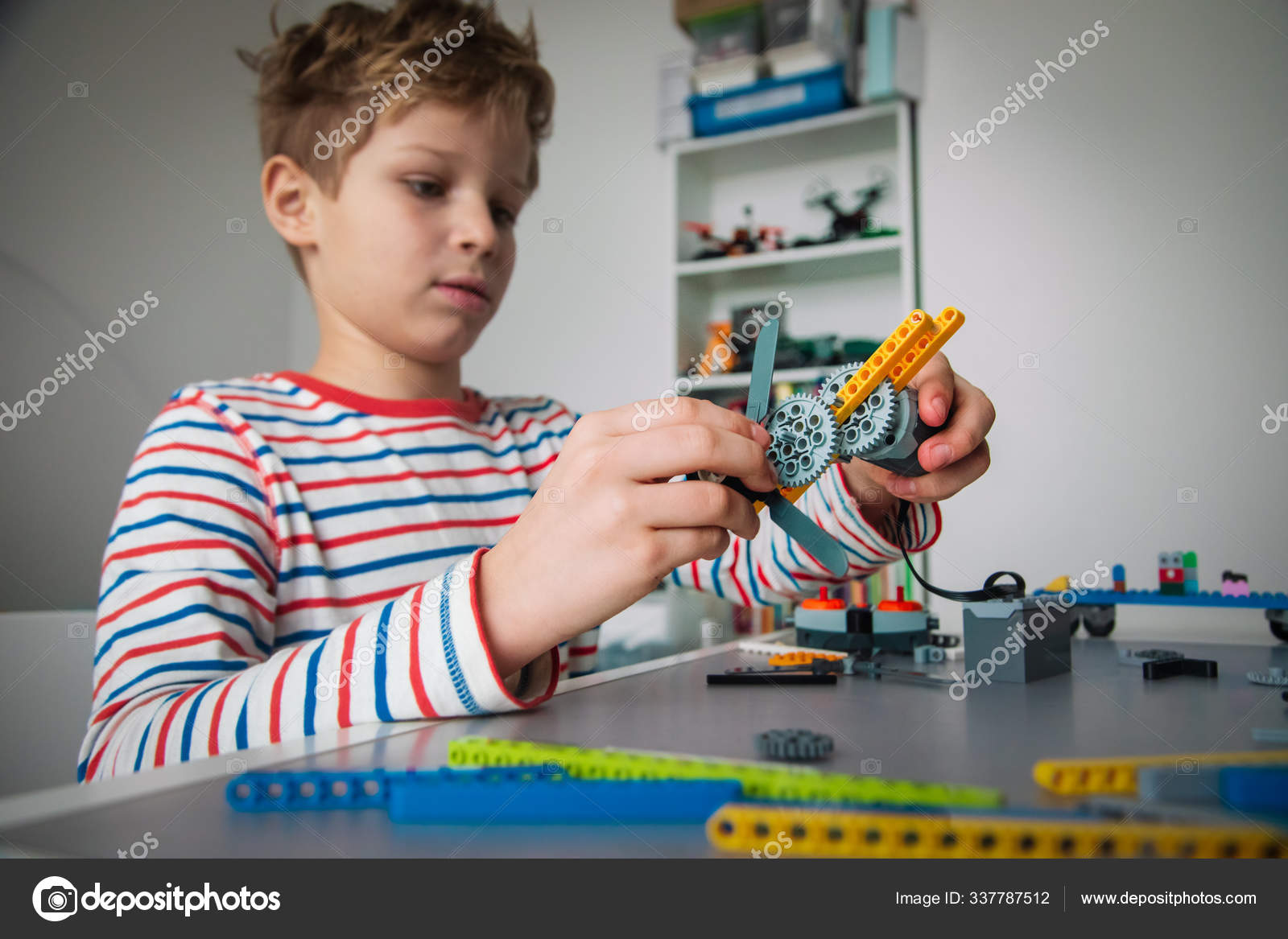 Child building robot at robotic technology school lesson Stock Photo by ...