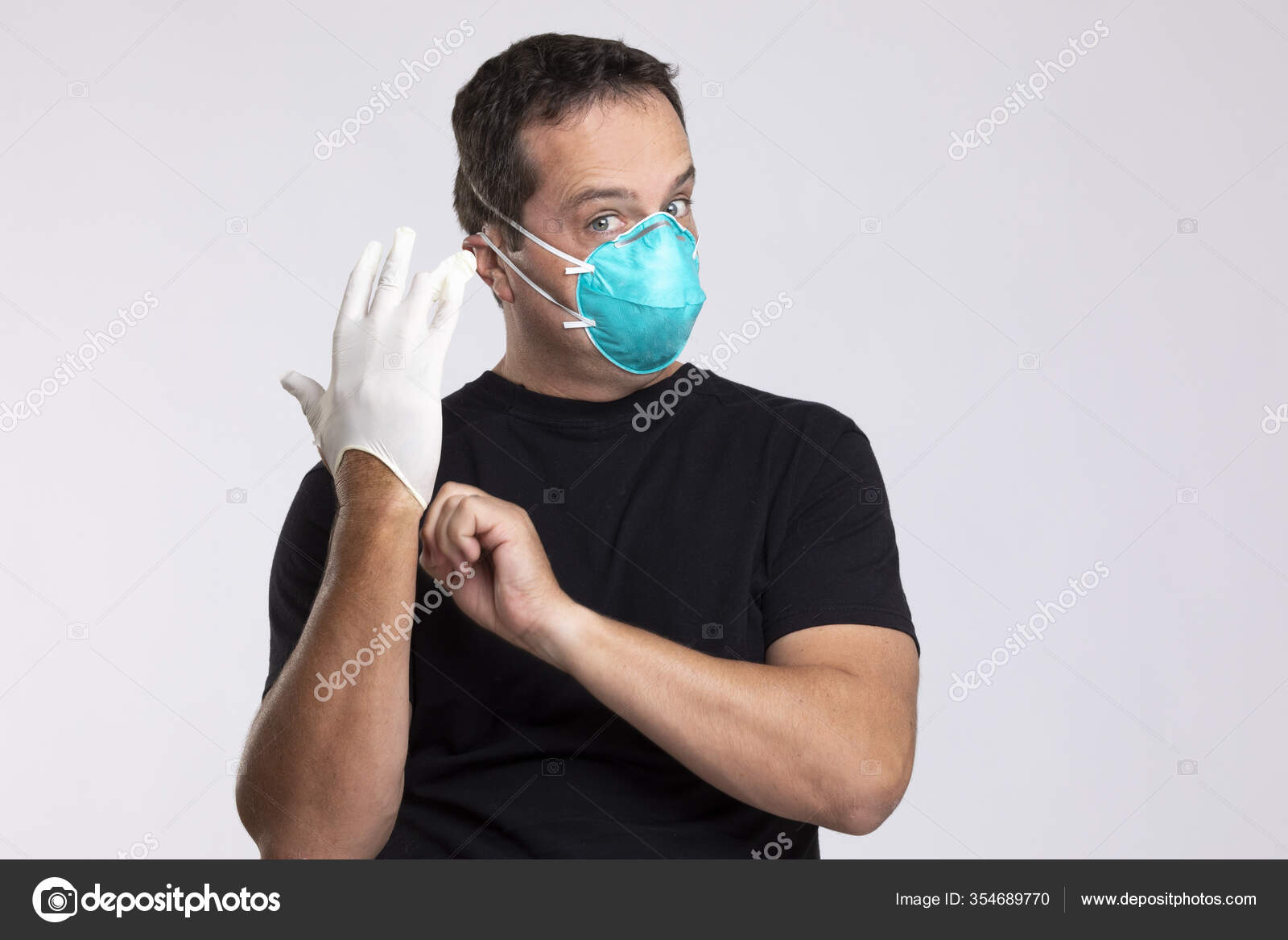 Man Surgical Mask Putting Latex Gloves — Stock Photo © danienel #354689770
