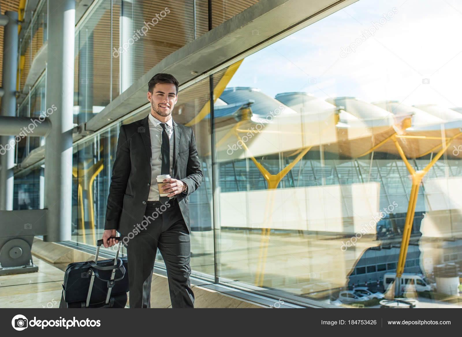 Young Businessman Walking Airport Terminal Luggage Smiling Coffee Stock ... Young Businessman Walking Airport Terminal Luggage Smiling Coffee Stock ...
