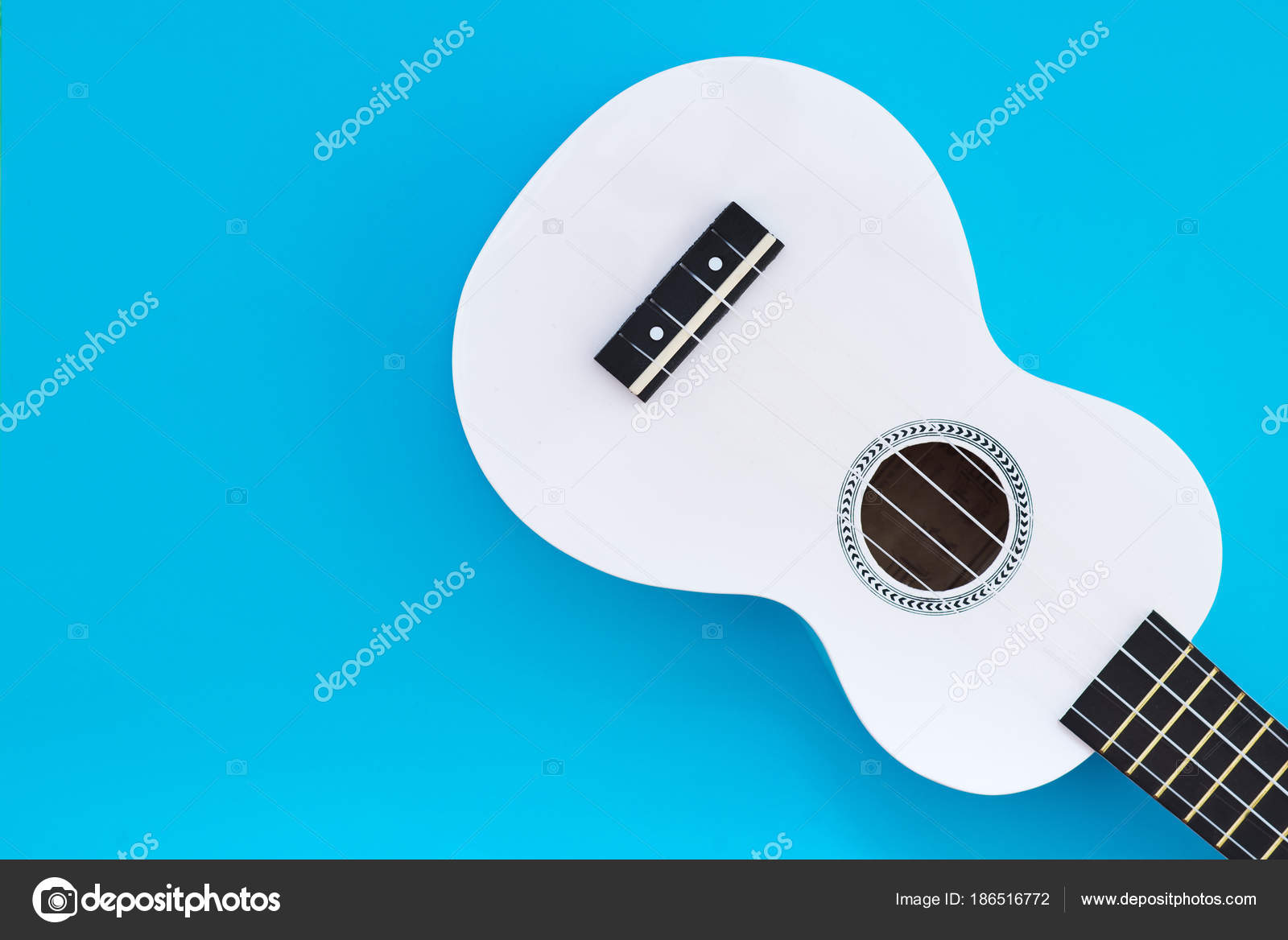 White ukulele on a blue background. Musical concept. Flat Lay Ukulel ...