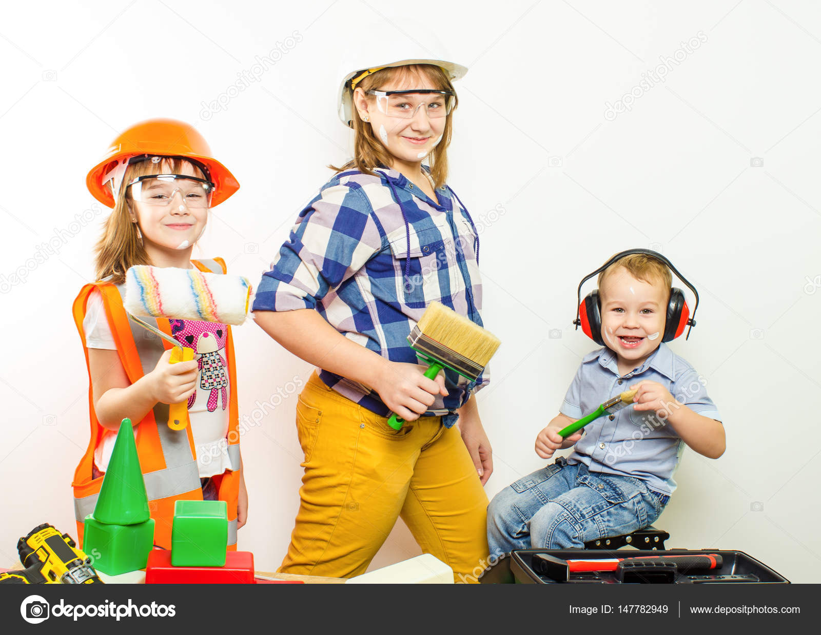 A group of children with construction tools, isolate of white ...
