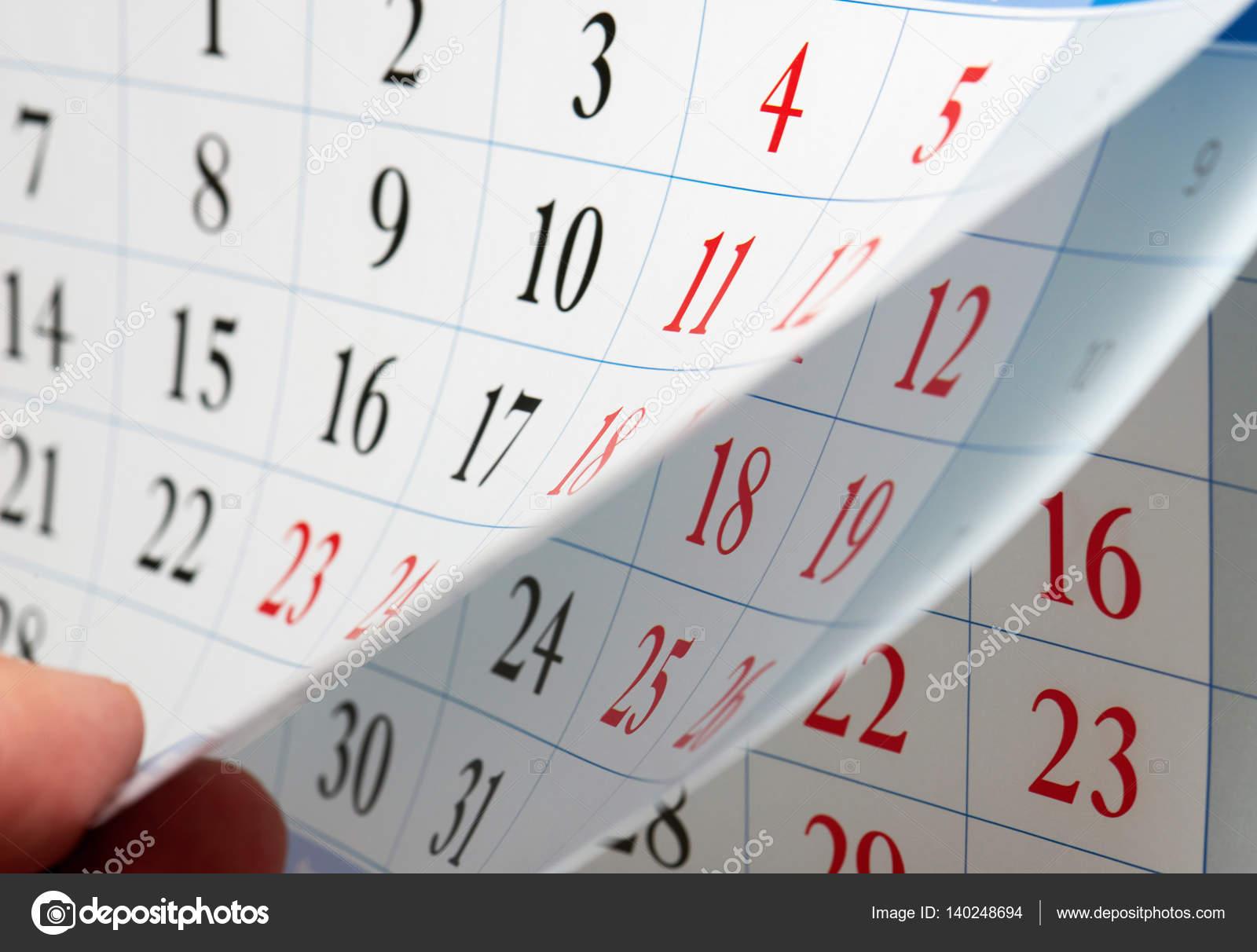 Fingers hold the calendar sheet Stock Photo by ©ovtynefoto 140248694
