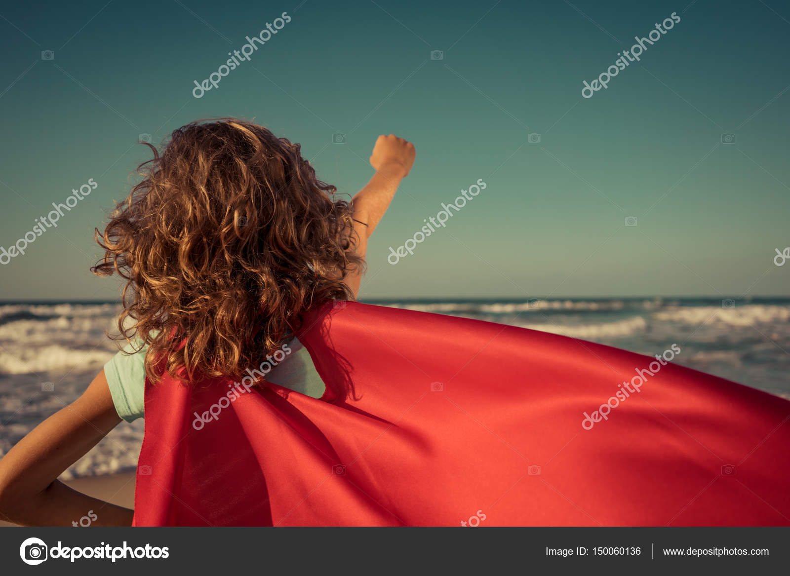 Superhero child on beach — Stock Photo © Yaruta #150060136